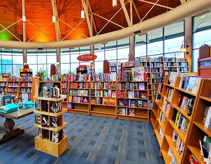 Fiction shelves stretching into the distance like a literary yellow brick road leading to your next favorite story.