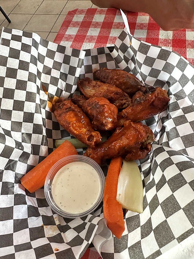 Golden wings with ranch and buffalo sauce, proving that even barbecue joints know how to diversify brilliantly.