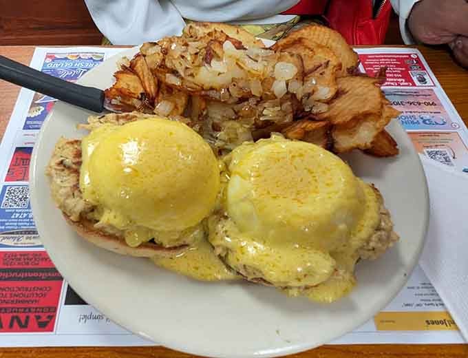 Eggs Benedict with hash browns so golden they could win a beauty pageant, if beauty pageants judged potatoes.