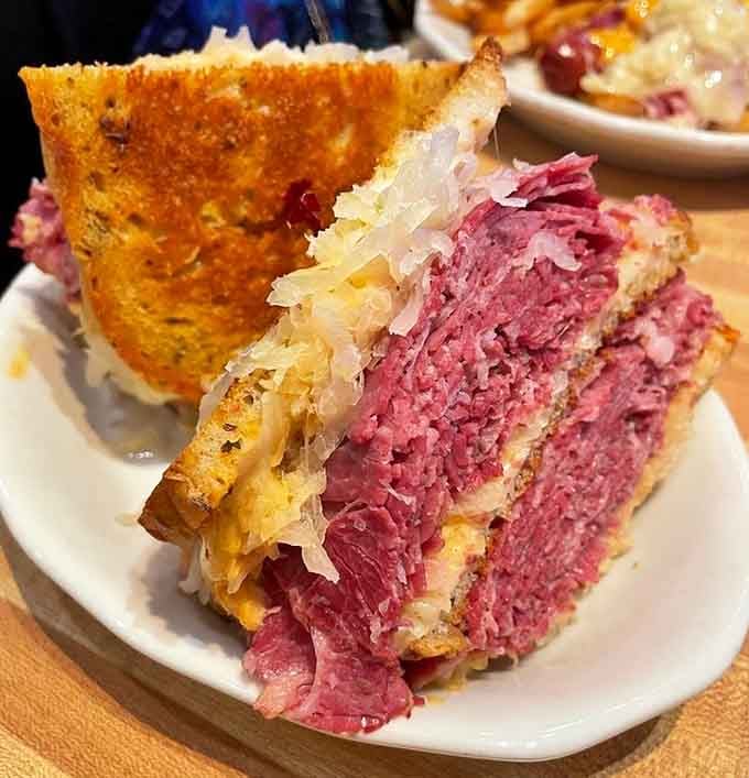 The Reuben: where Swiss cheese, sauerkraut, and corned beef have their most successful threesome since 1914.