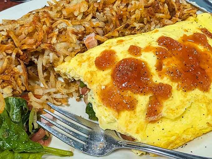 That omelet looks like it could solve most of your problems, or at least make you forget them for thirty minutes.