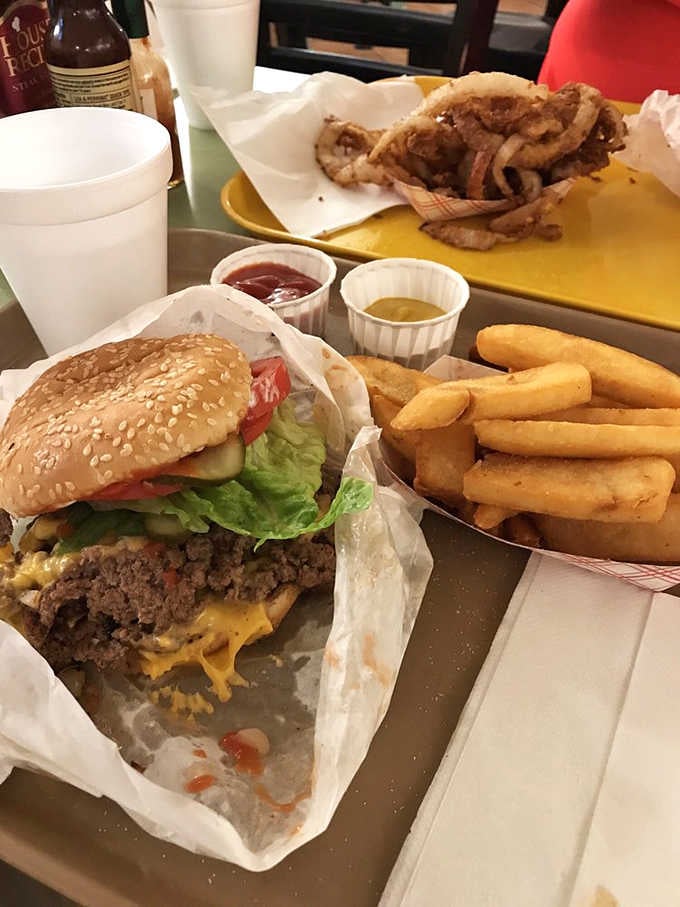 The quad burger with fries proves that sometimes more really is more, and your cardiologist can wait until tomorrow.