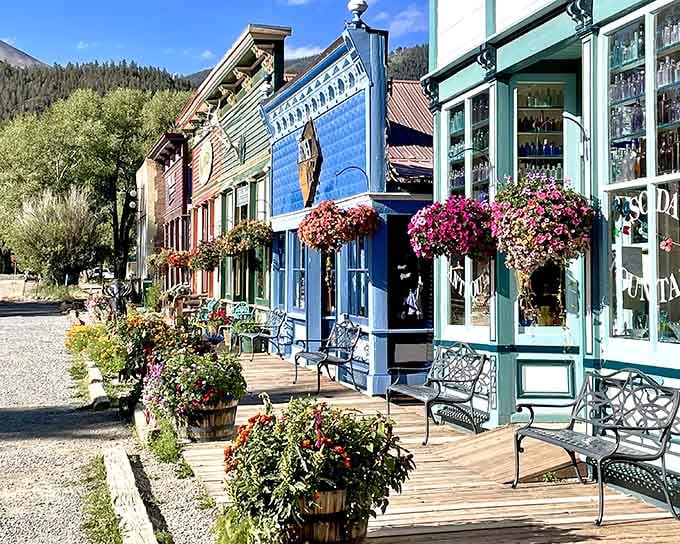 Hanging flower baskets overflow with color while wooden boardwalks invite leisurely strolls past shops that actually know your name.