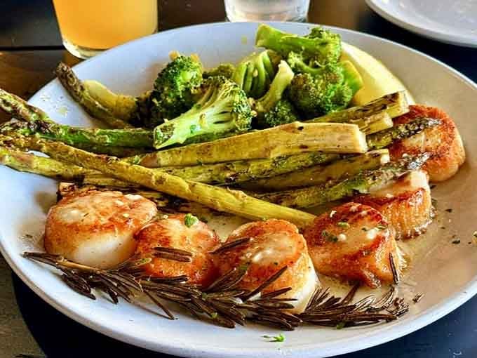 Seared scallops with roasted vegetables showcase how fresh seafood needs little more than skillful preparation to absolutely shine.
