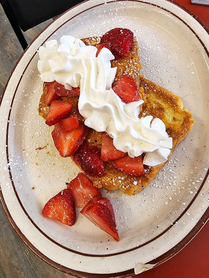 French toast topped with strawberries and whipped cream, because sometimes you deserve to start sweet.