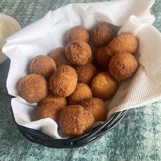 These golden hush puppies are the supporting actors that steal every scene, crispy outside and tender within.