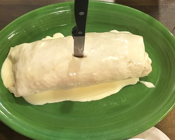 Sometimes a burrito wrapped this generously is all the therapy you need, especially when it's drowning in that gorgeous cheese sauce.