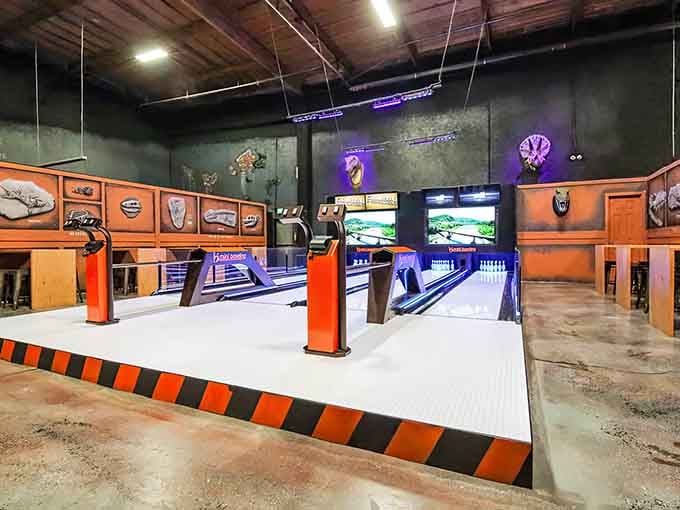Bowling lanes gleam under purple lights, bringing retro charm to this modern indoor playground with serious style.
