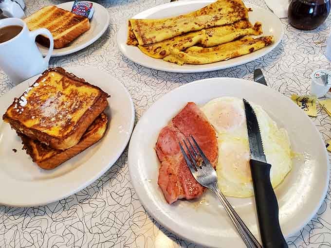 French toast, crepes, ham and eggs spread across the table like a breakfast buffet for champions.