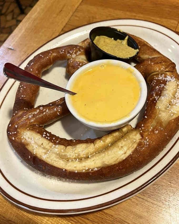 A pretzel so large it could double as a life preserver, served with mustard and cheese.