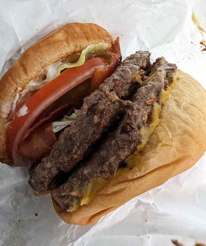 Two patties stacked high because sometimes one burger just isn't enough to satisfy your soul.