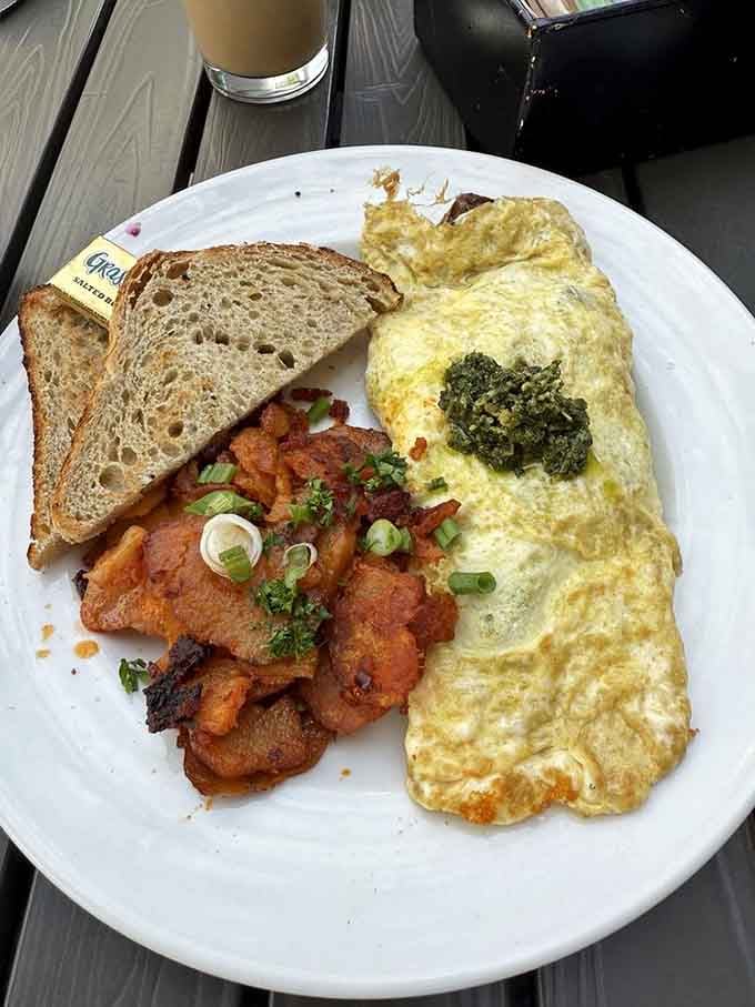 This omelet arrives fluffy and generous, stuffed with ingredients that show someone in that kitchen actually cares about what you're eating.