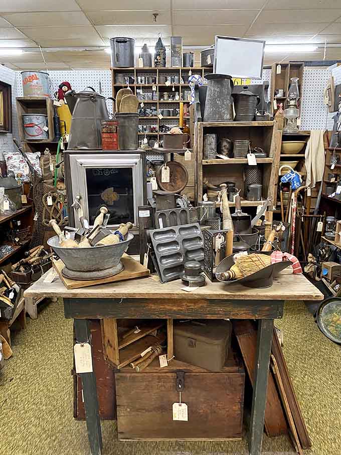 Rustic kitchen tools and vintage cookware stacked high, proving grandma's gadgets were built to last.