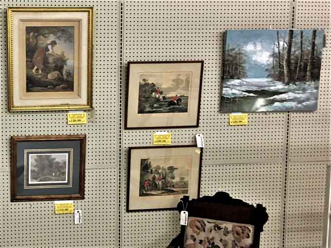 Vintage artwork on pegboard walls, waiting for someone to appreciate their old-school charm once again.