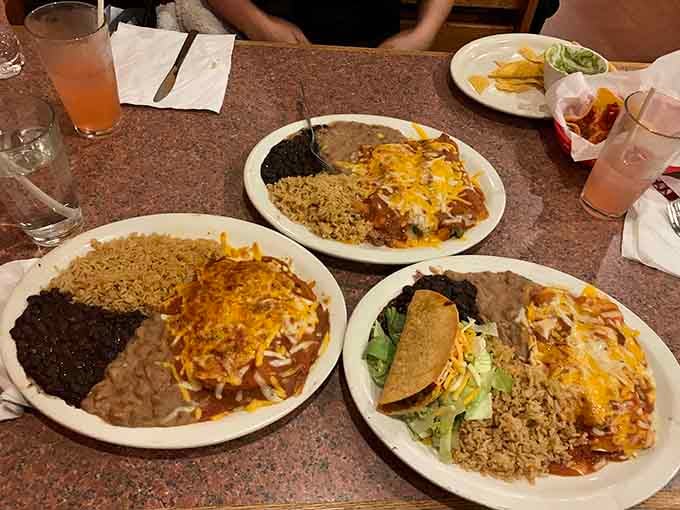 A table full of enchilada plates means someone made excellent life choices and probably needs a nap afterward.
