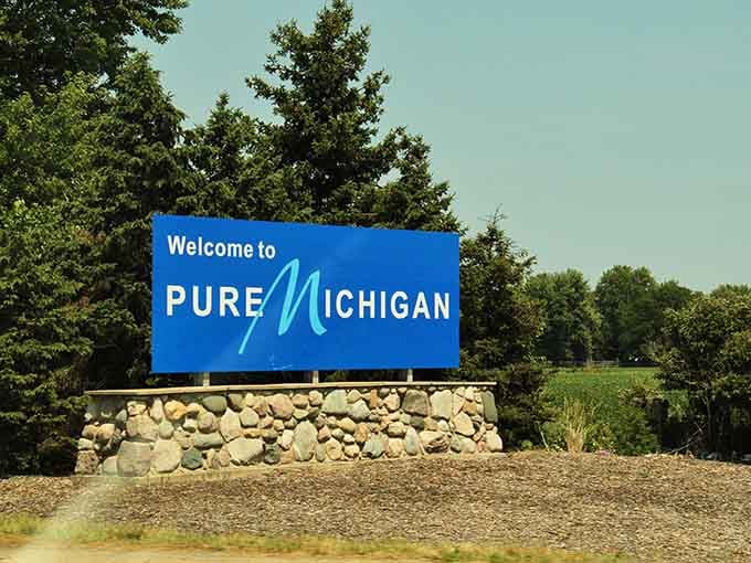 Stone base, blue sign, green landscaping. The holy trinity of "welcome home" moments for every Michigander out there.