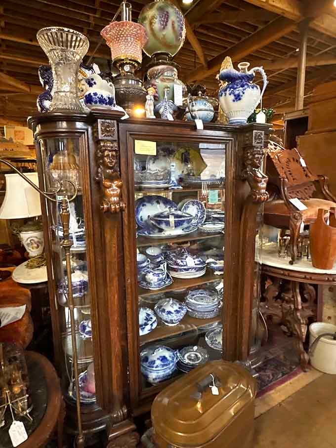 Blue and white china arranged in a cabinet that would make any grandmother nod approvingly at the display.