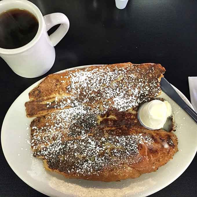 French toast this size requires commitment, strategy, and possibly a designated nap time afterward for recovery.