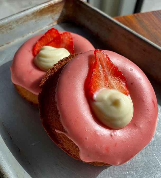 Fresh strawberries and cream cheese frosting on a mochi donut proves that some combinations are simply meant to be together.
