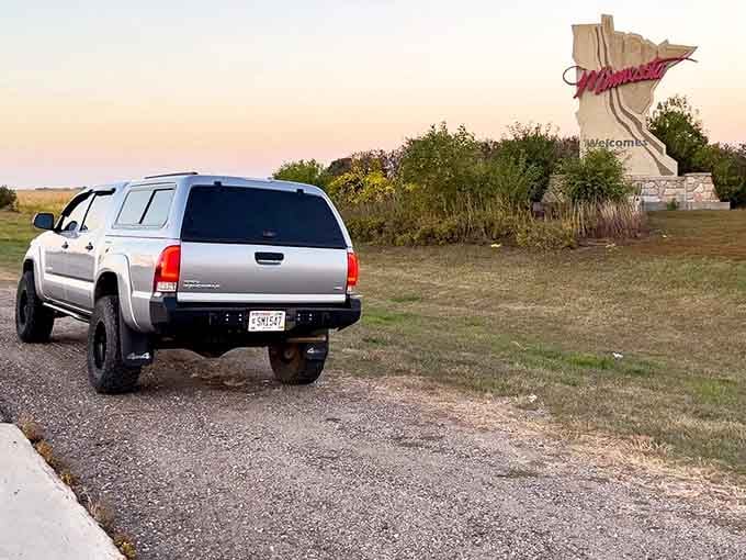 When your vehicle becomes part of the joke, parked at a Minnesota sign that's definitely not in Minnesota.