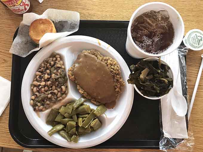 Southern fried steak with black-eyed peas and green beans: comfort food that actually comforts instead of just filling space.