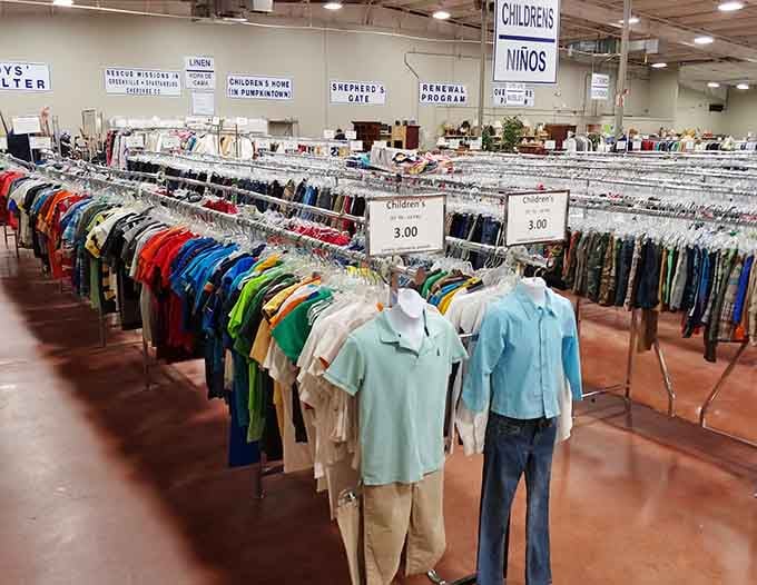 Kids' clothes organized by size because even bargain hunting deserves a little civilized order here.