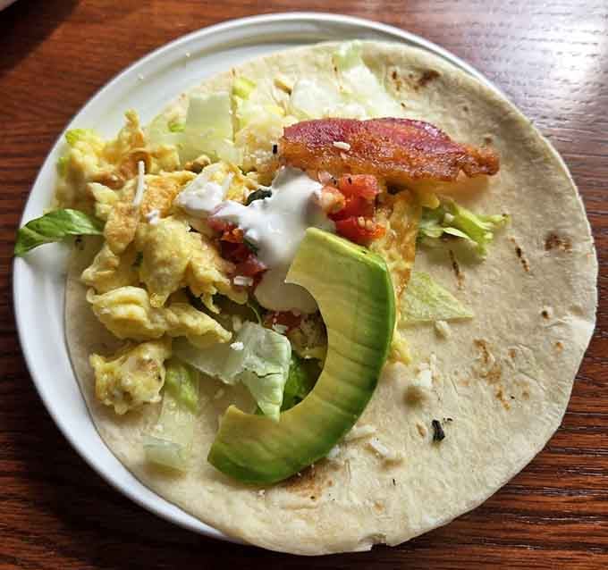 The Mañana taco loaded with scrambled eggs, bacon, and avocado, basically breakfast's answer to the perfect handheld meal.