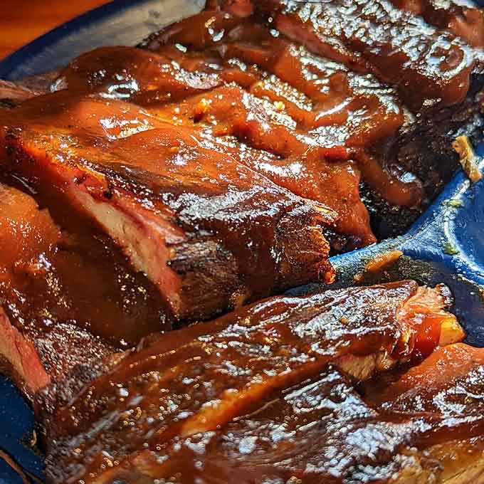 Glistening with sauce like they just won a beauty pageant for the most photogenic barbecue in Missouri.