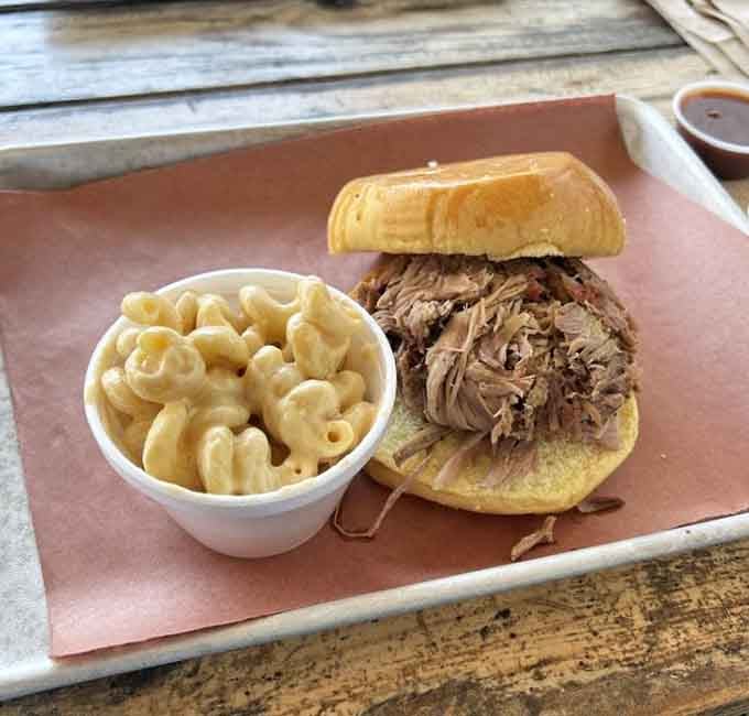 Pulled pork piled high on a bun, partnered with mac and cheese because moderation is overrated today.