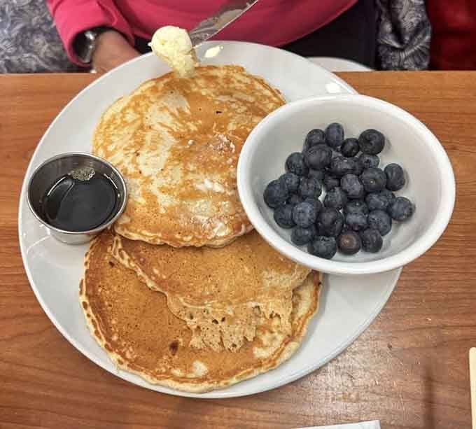 Fluffy pancakes with blueberries on the side, because sometimes you want to control your own fruit-to-pancake ratio destiny.