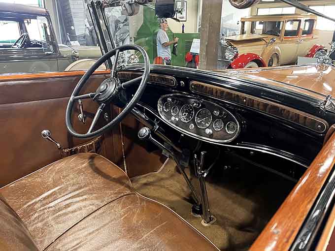 Leather bench seats and analog gauges remind you that driving once required actual skill, not just touchscreen proficiency and patience.