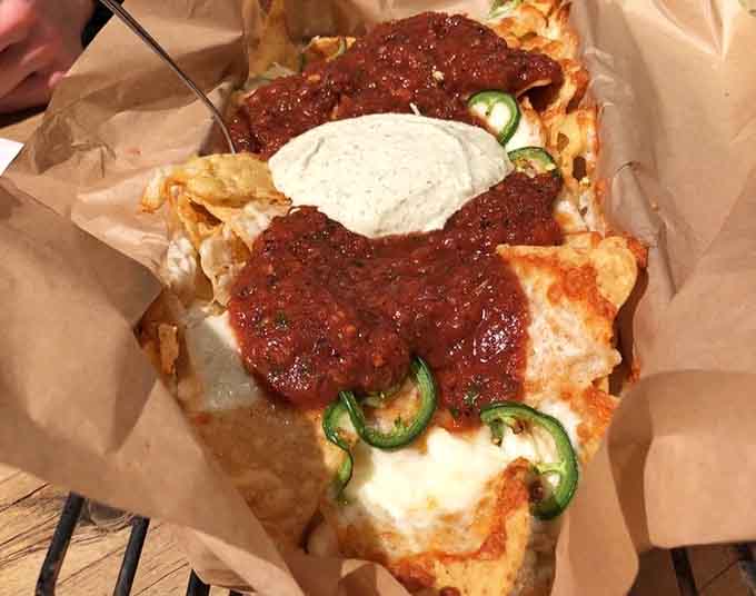 Pizza topped with jalapeños and marinara that's practically begging you to take a break from conquering territories on the board.