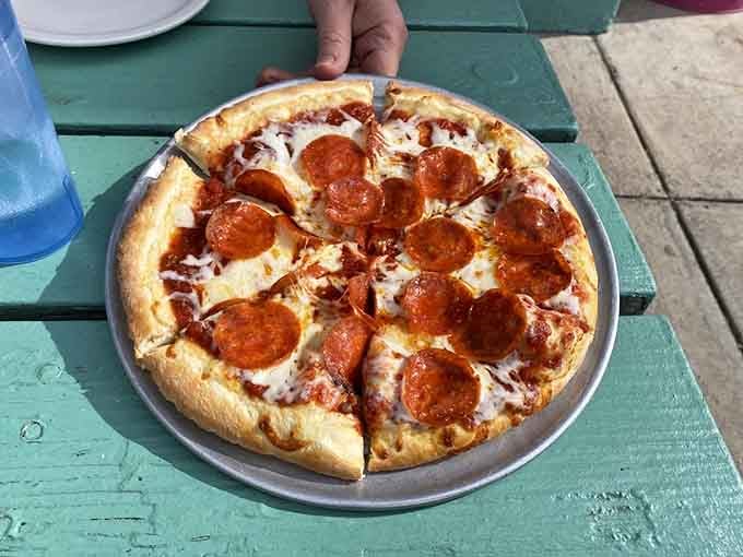 Pepperoni pizza enjoyed under the Arizona sun, because even retro diners know pizza makes everything better.