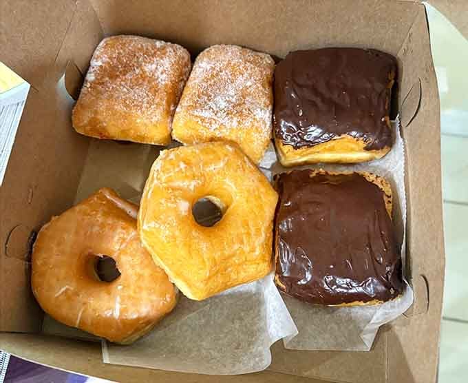 Donuts that range from classic glazed to chocolate-covered perfection, each one a small work of edible art.