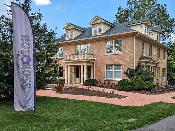 The Bob Ross Experience welcomes visitors to a brick building where happy little trees find their home.