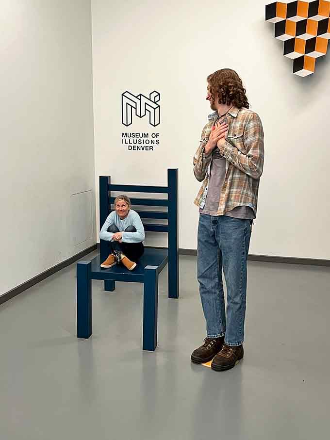 One chair, two people, completely different sizes, and your brain just blue-screened trying to process the math.