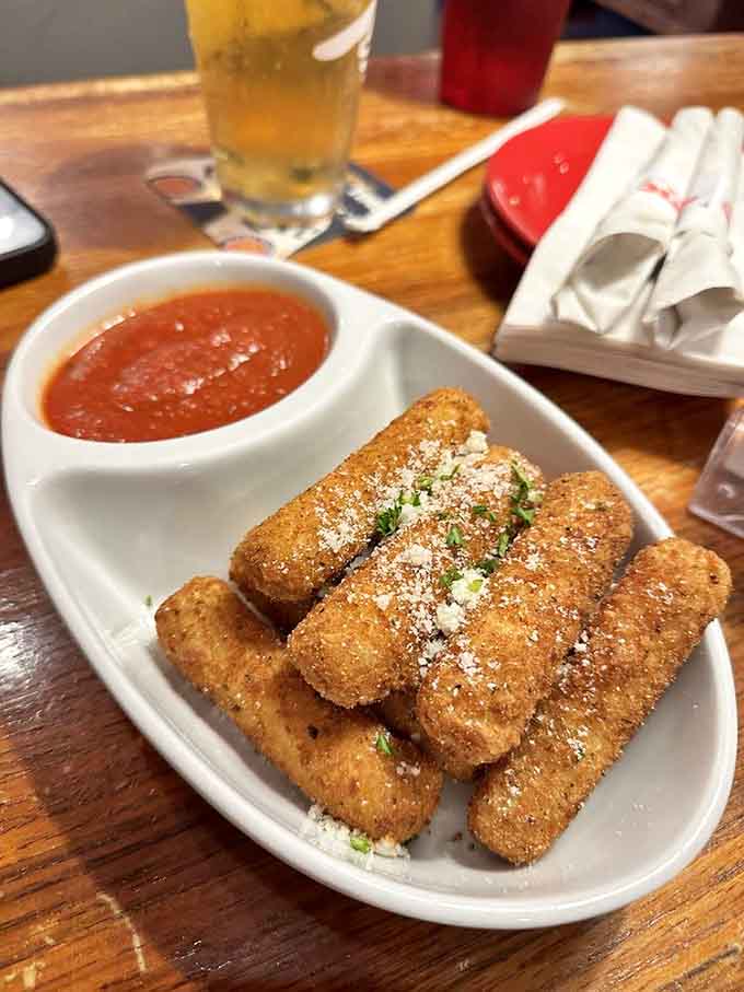 Golden-fried mozzarella sticks with that perfect cheese pull prove that some classics never need improving or reinventing.