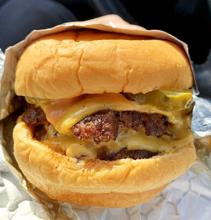 When your burger needs its own structural support system, you know you're doing something gloriously right here.