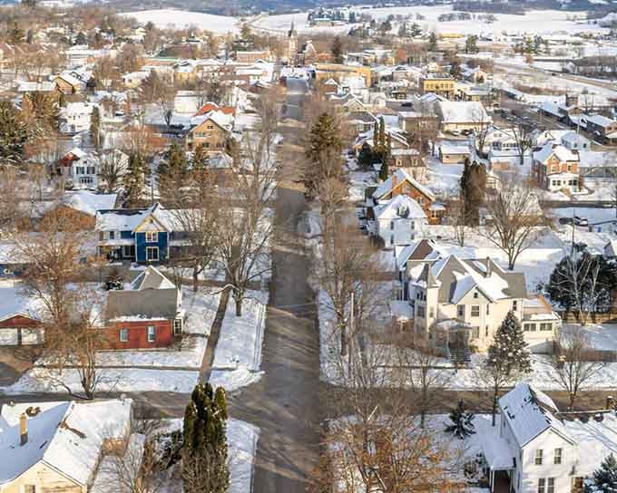 Snow-dusted rooftops transform New Glarus into a winter wonderland that rivals any European Christmas card scene.