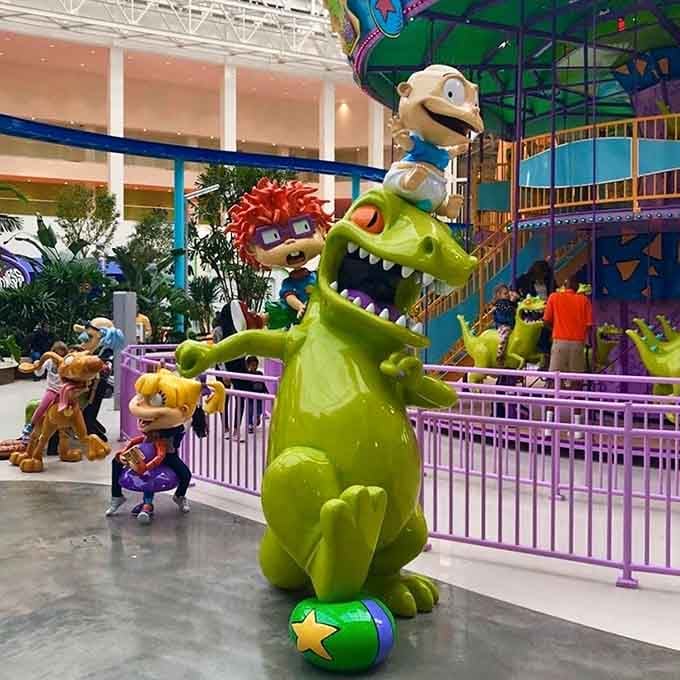 When a giant green dinosaur becomes your photo buddy, you know you've officially left reality at the door.