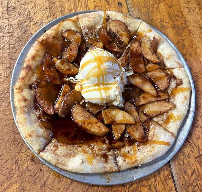 Dessert pizza topped with caramelized bananas and whipped cream, because why should dinner have all the fun?