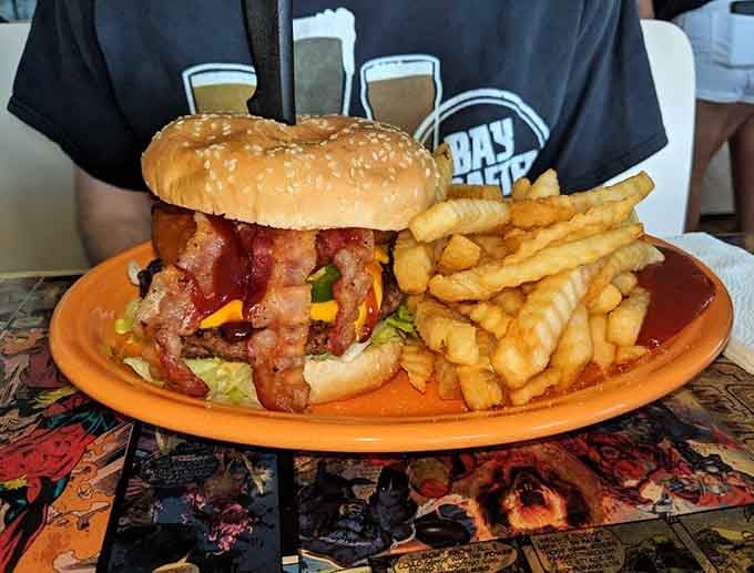 Those golden onion rings are hand-battered perfection, crispy on the outside and tender within every single bite.