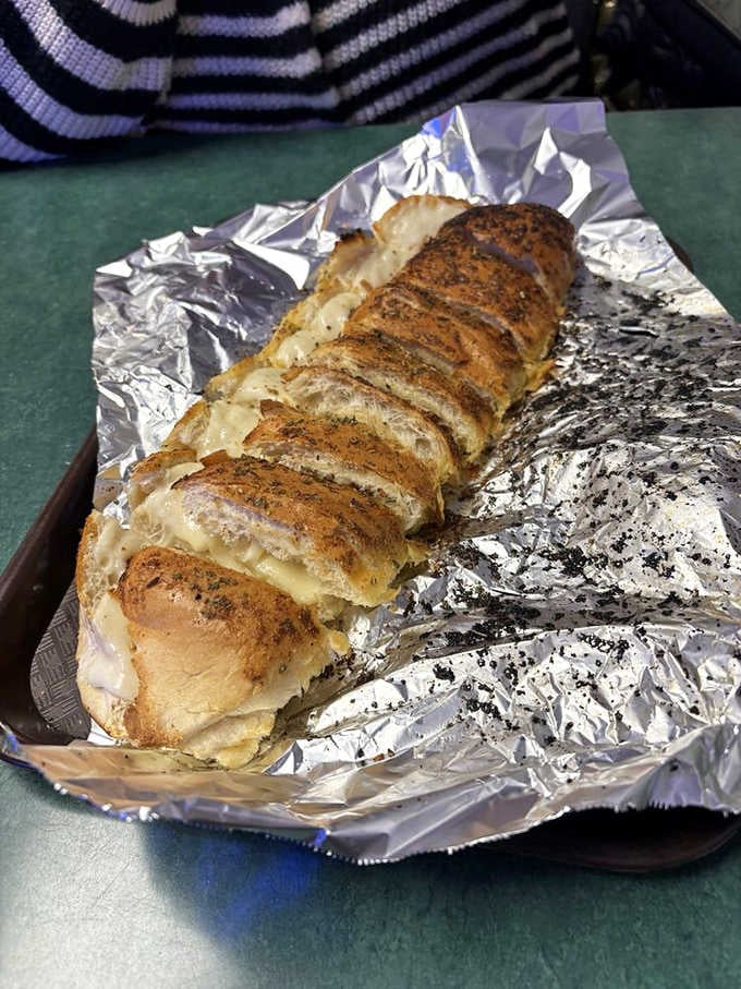 Garlic bread sliced and ready, because sometimes the supporting actor steals the show with buttery, aromatic brilliance that demands attention.