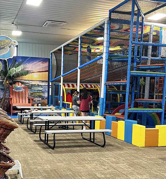 Beach-themed seating lets parents relax while kids burn energy, a combination more valuable than gold itself.