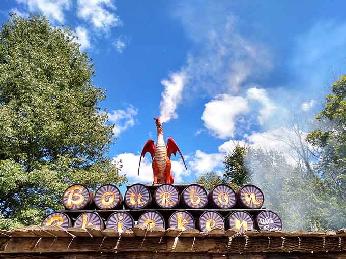 A fire-breathing dragon perches atop barrels, casually reminding visitors that mythical creatures make excellent festival decorations.
