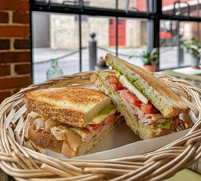 Fresh ingredients stacked high on toasted bread, because sometimes simple combinations create the most memorable meals.