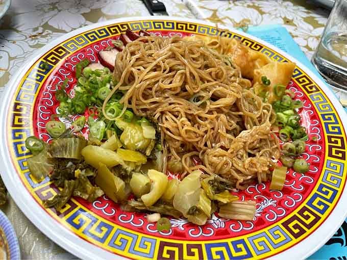 Wonton mee goreng arrives looking like the kind of noodle dish that makes you forget every other noodle you've ever eaten.