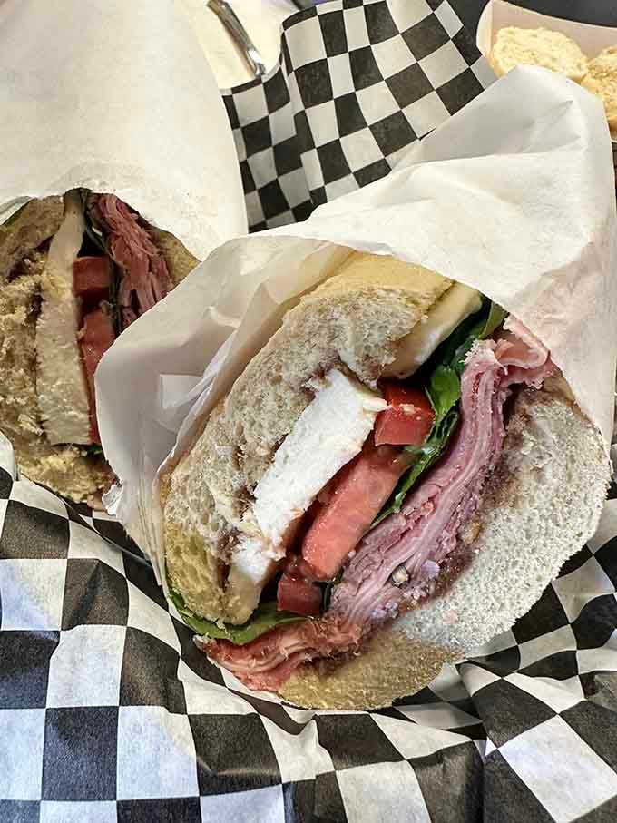 An Italian sub stuffed so generously that eating it requires both hands, strategic planning, and possibly a structural engineering degree.