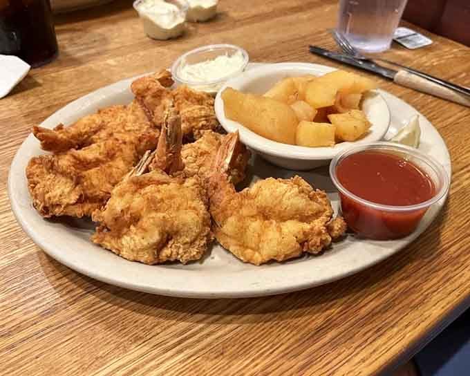 Fried shrimp piled high with sides that understand the assignment: make everything delicious and plentiful.
