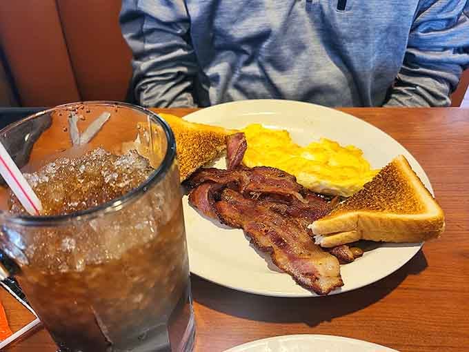 Eggs, bacon, and toast proving that breakfast doesn't need to be fancy to be absolutely perfect.